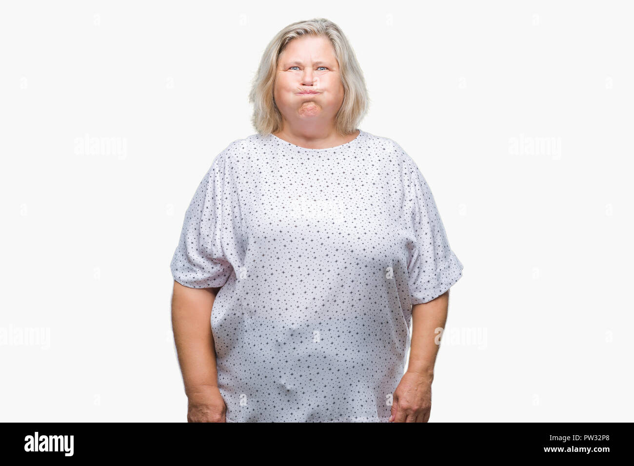 Senior plus size caucasian woman over isolated background puffing ...