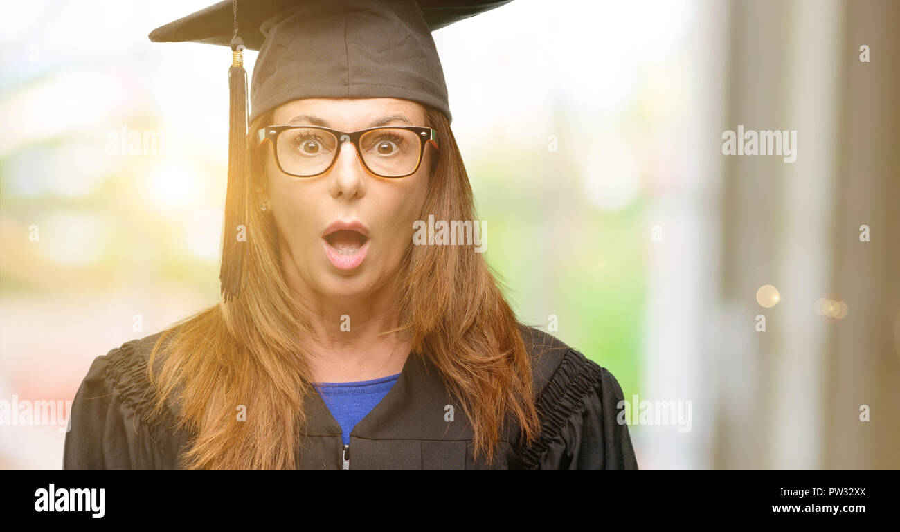 Senior graduate student woman scared in shock, expressing panic and ...