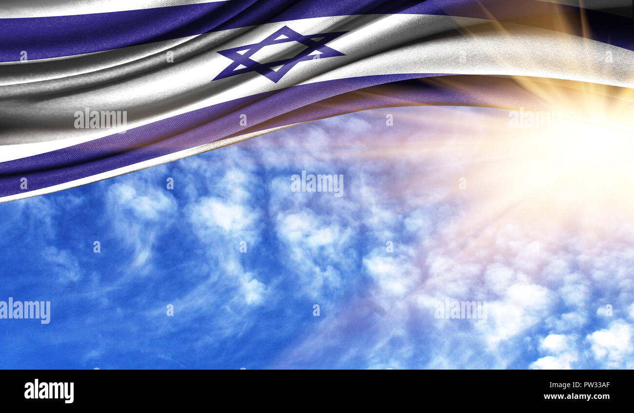 the flag of Israel in the rays of the summer sun, in the sky ...
