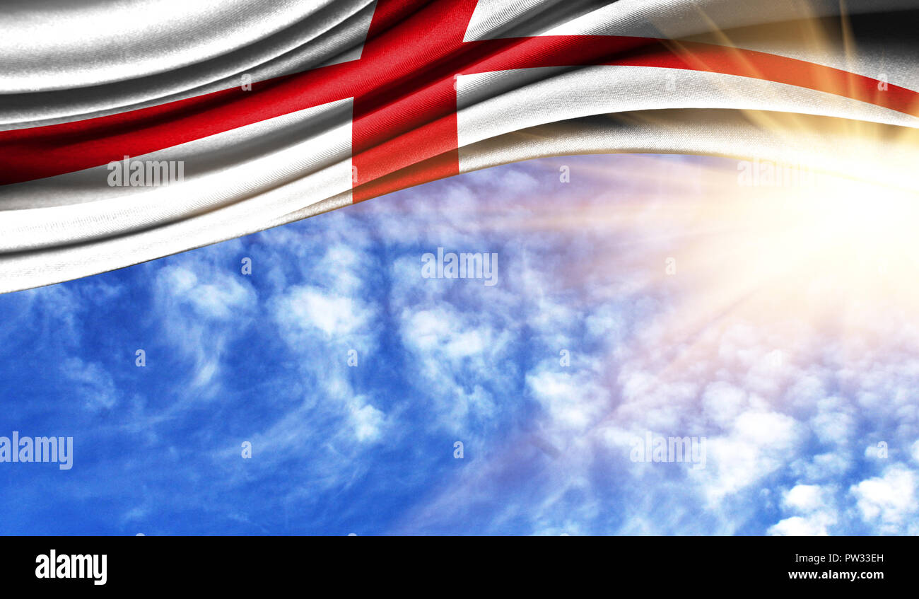 the flag of England in the rays of the summer sun, in the sky ...
