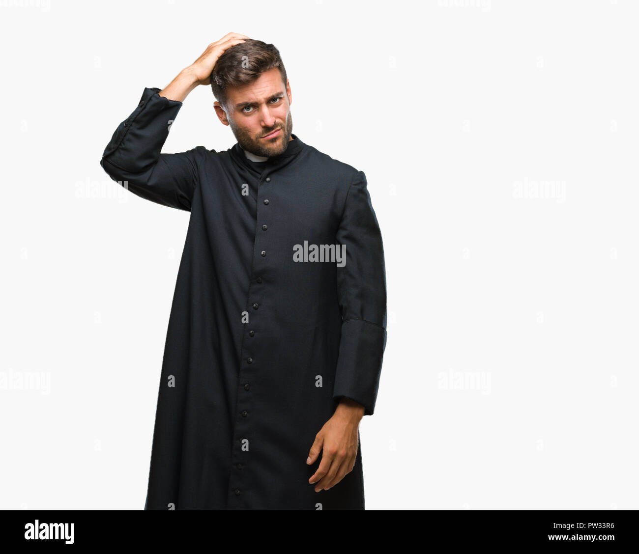 Young catholic christian priest man over isolated background confuse ...