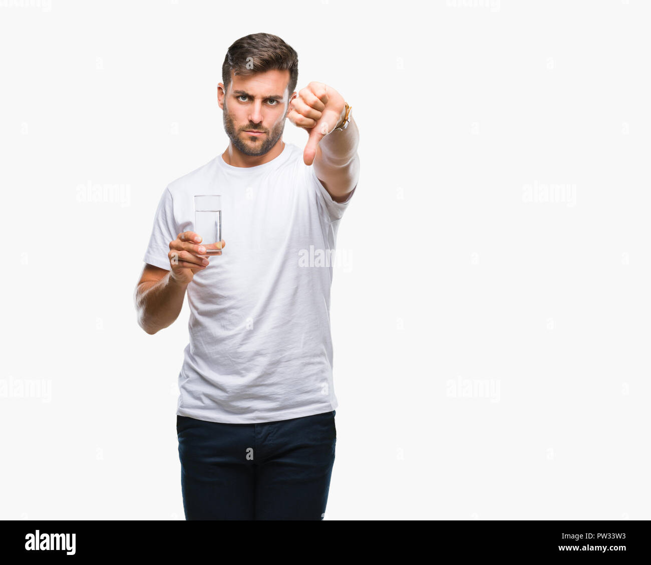 Young handsome man drinking glass of water over isolated background ...
