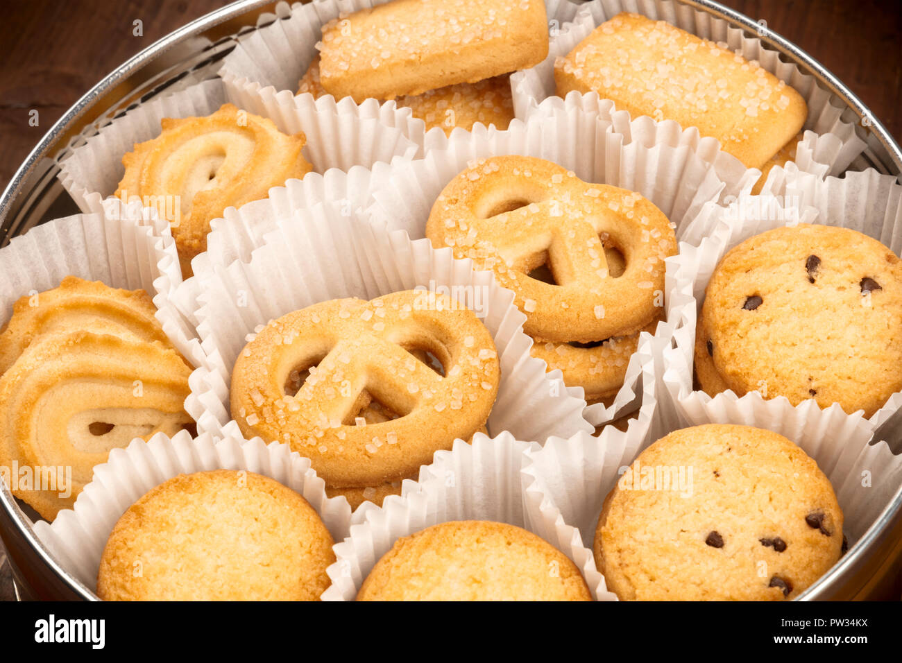 A closeup photo of Danish butter cookies in the traditional tin box ...