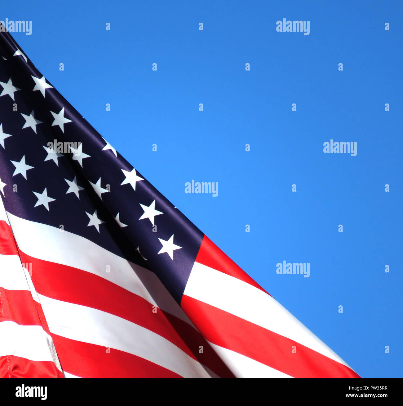Realistic flag of America on the wavy surface of fabric. This flag can ...