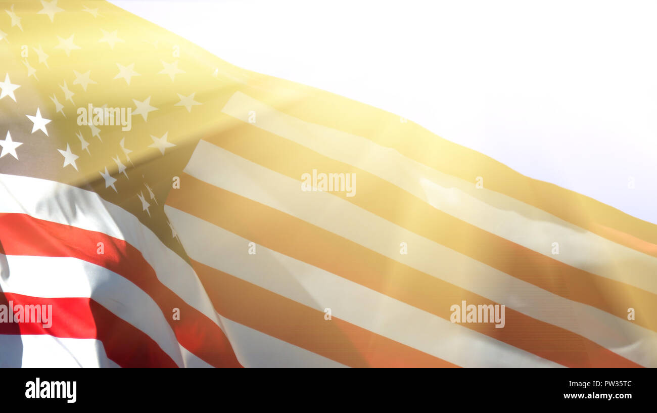 flag of America against the blue sky with sun rays Stock Photo - Alamy