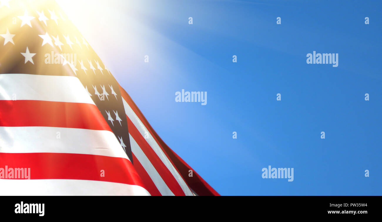 flag of America against the blue sky with sun rays Stock Photo - Alamy