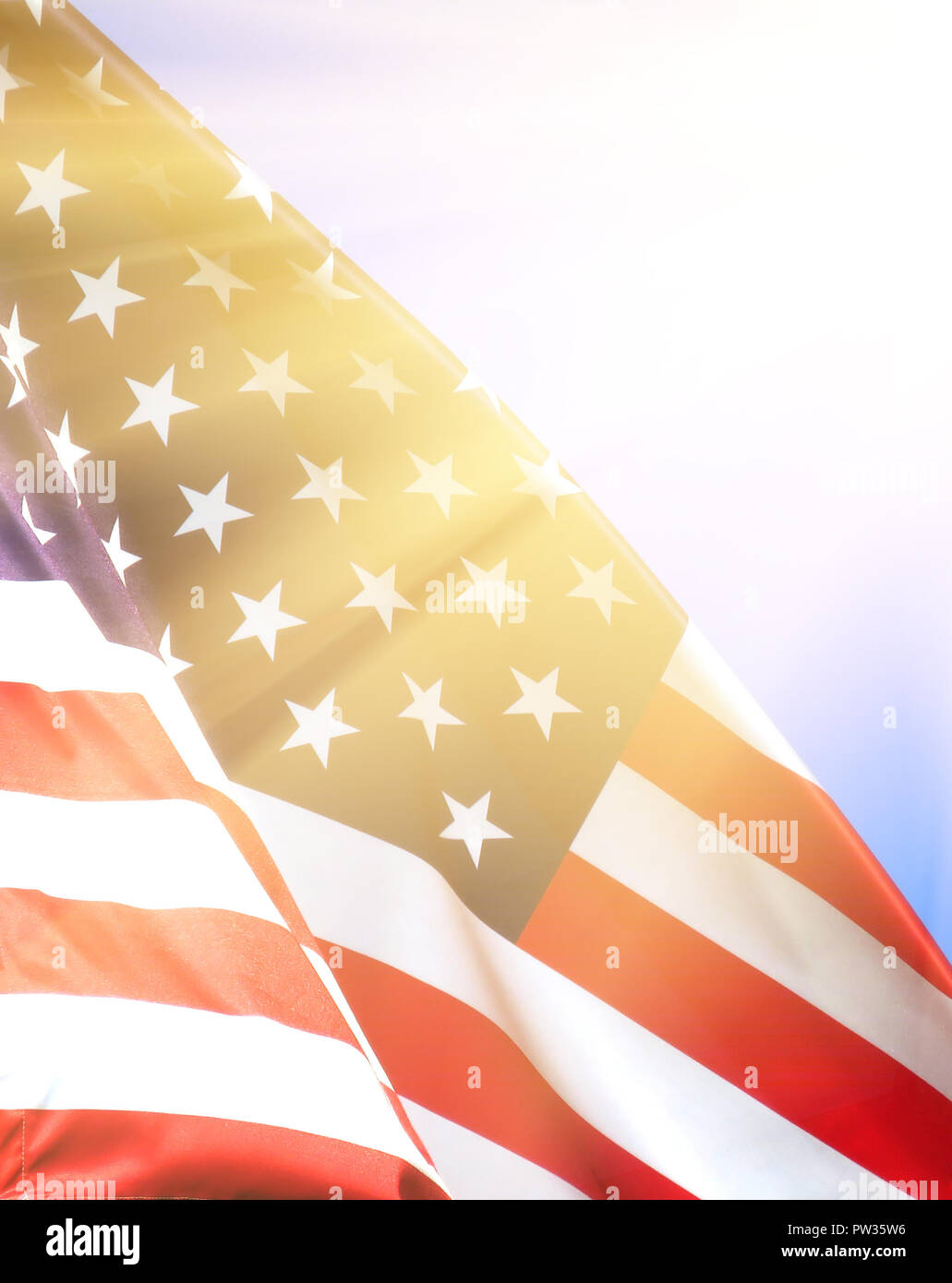 flag of America against the blue sky with sun rays Stock Photo - Alamy