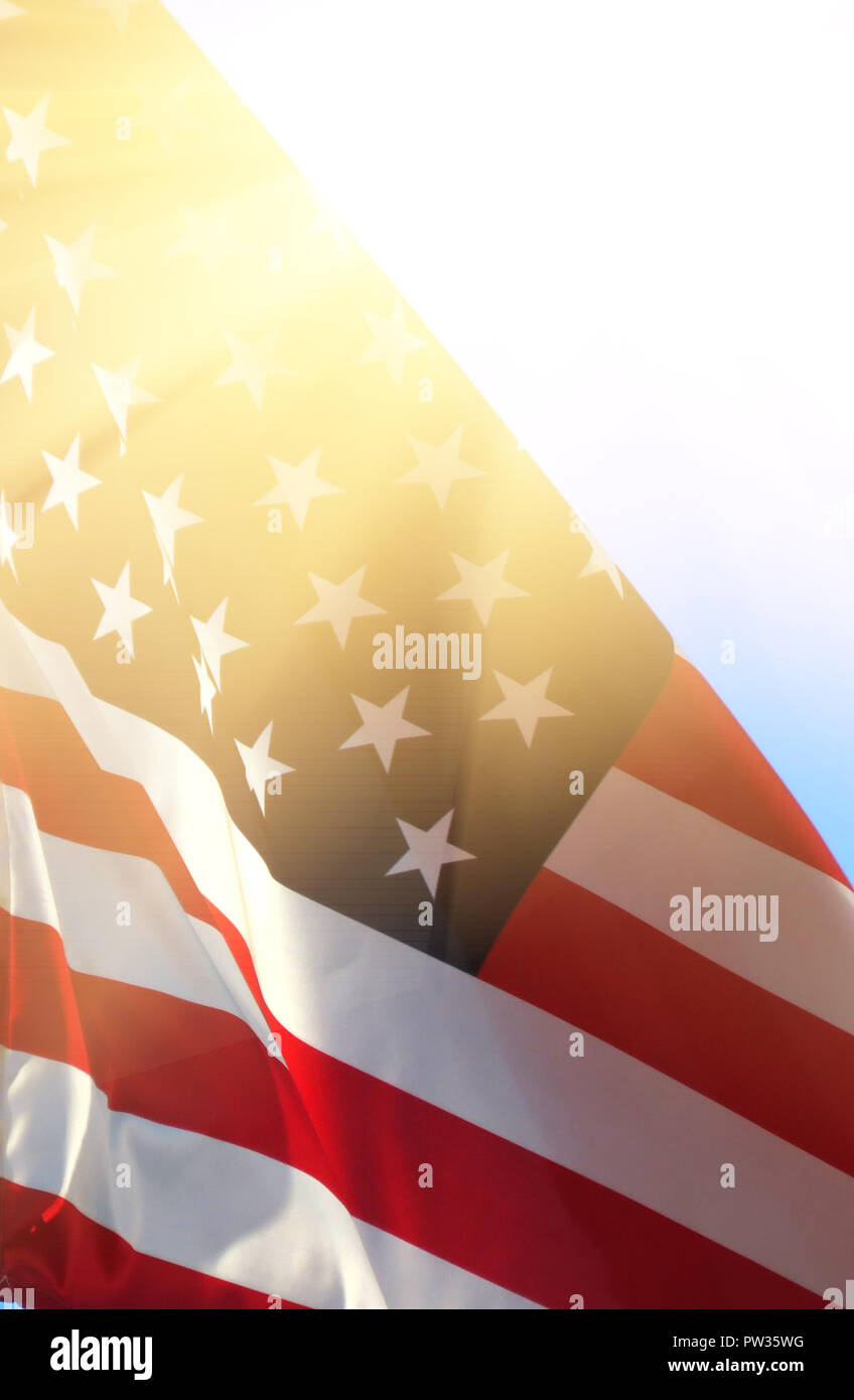 flag of America against the blue sky with sun rays Stock Photo - Alamy