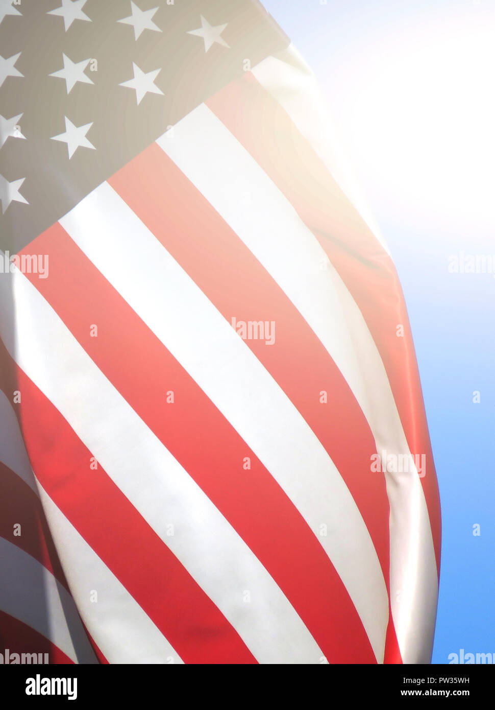 flag of America against the blue sky with sun rays Stock Photo - Alamy