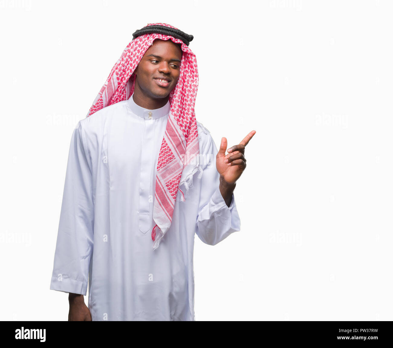 Young arabic african man wearing traditional keffiyeh over isolated ...