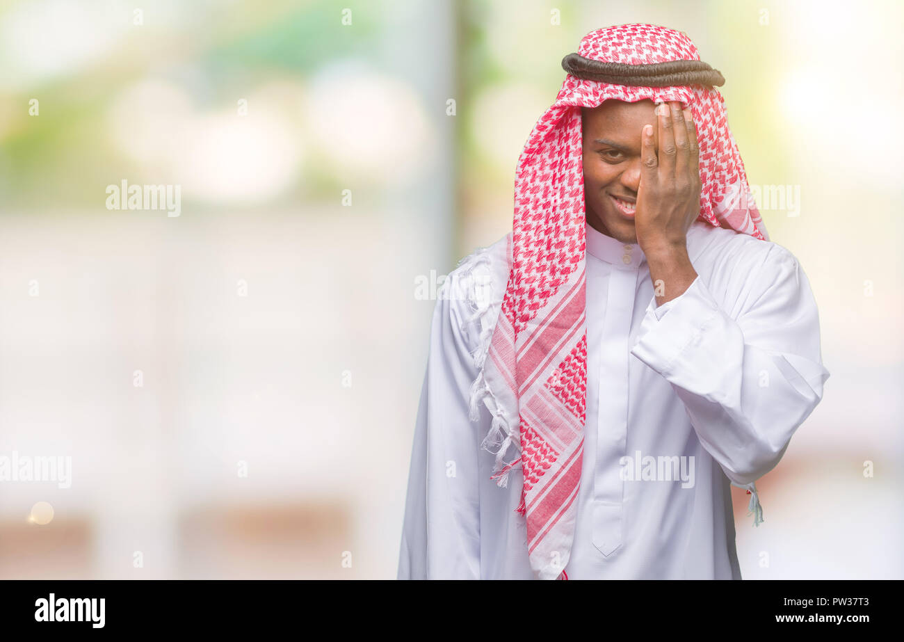 Young arabic african man wearing traditional keffiyeh over isolated ...