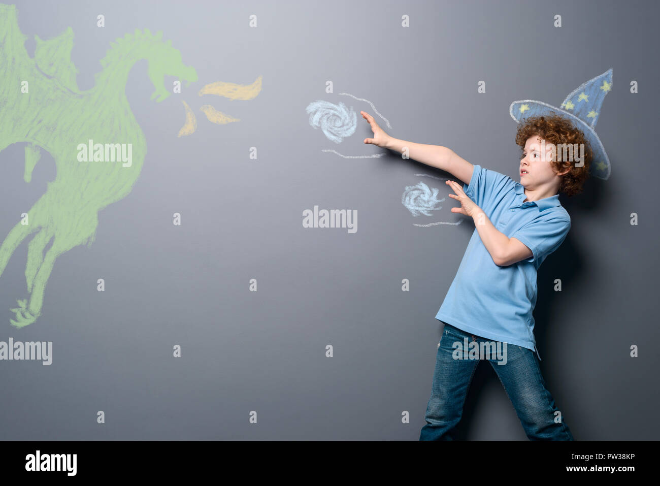 Fight of wizard and dragon Stock Photo - Alamy