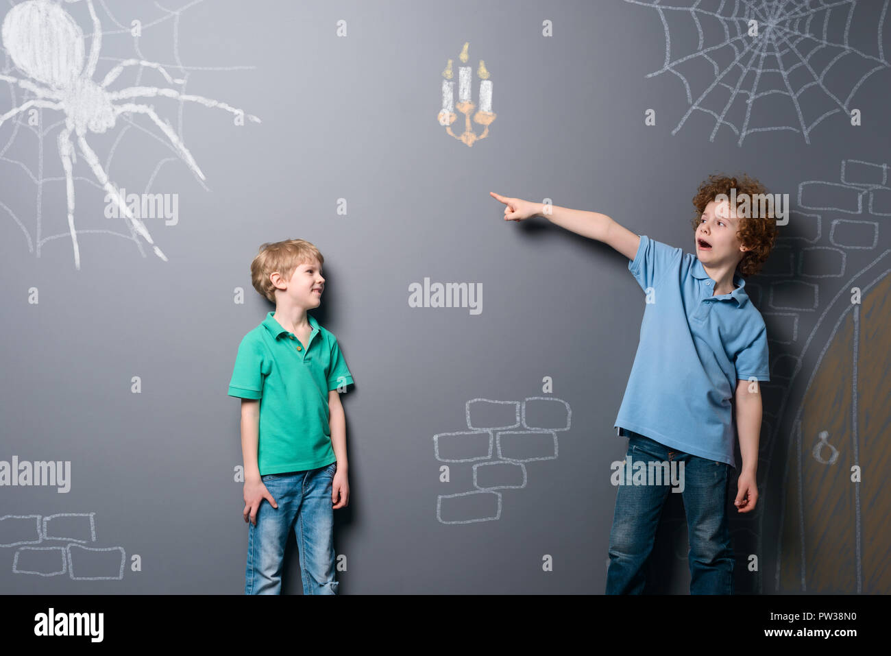 Boys and a big spider Stock Photo - Alamy