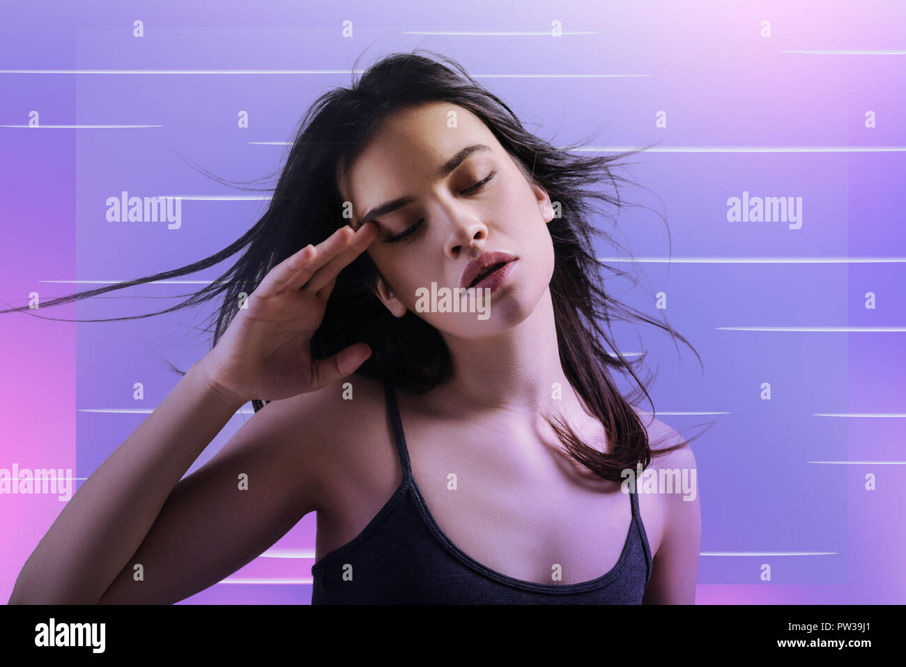 Attractive woman closing her eyes Stock Photo - Alamy