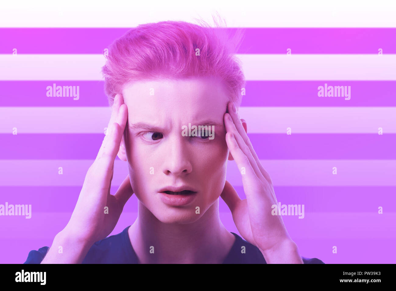 Astonished handsome guy facing trouble Stock Photo - Alamy