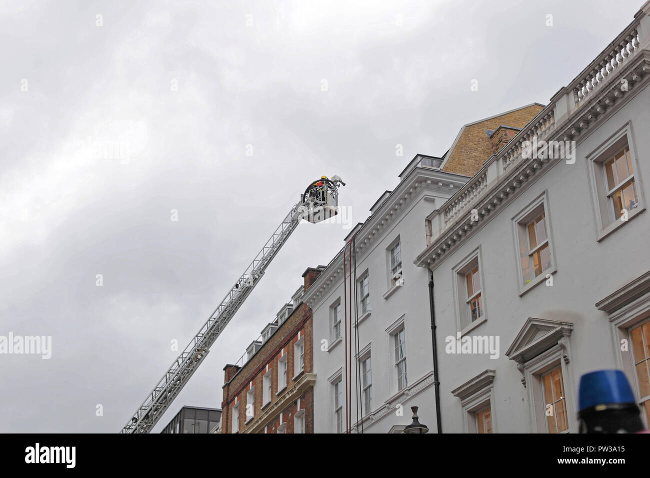 Fire Fighters at Telescopic Boom Aerial Ladder Platform Stock Photo - Alamy