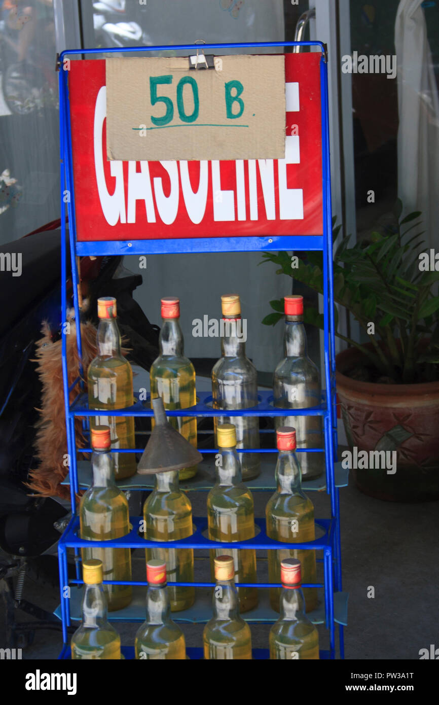 Gasoline in whiskey and syrup bottles in Thailand Stock Photo - Alamy