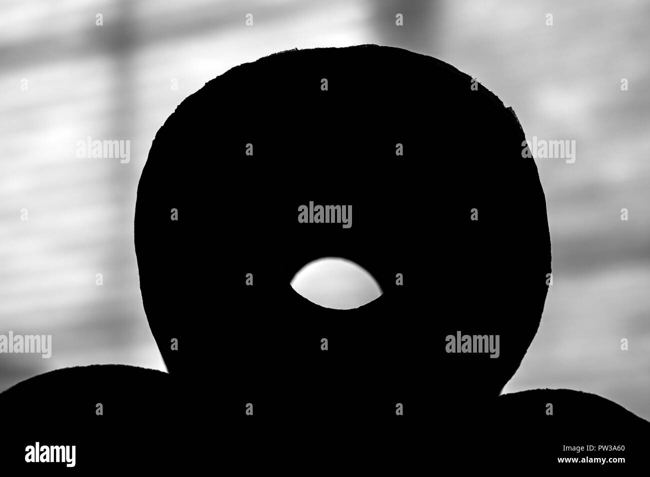 Toilet paper with heavy contrast creating abstract patterns in black ...