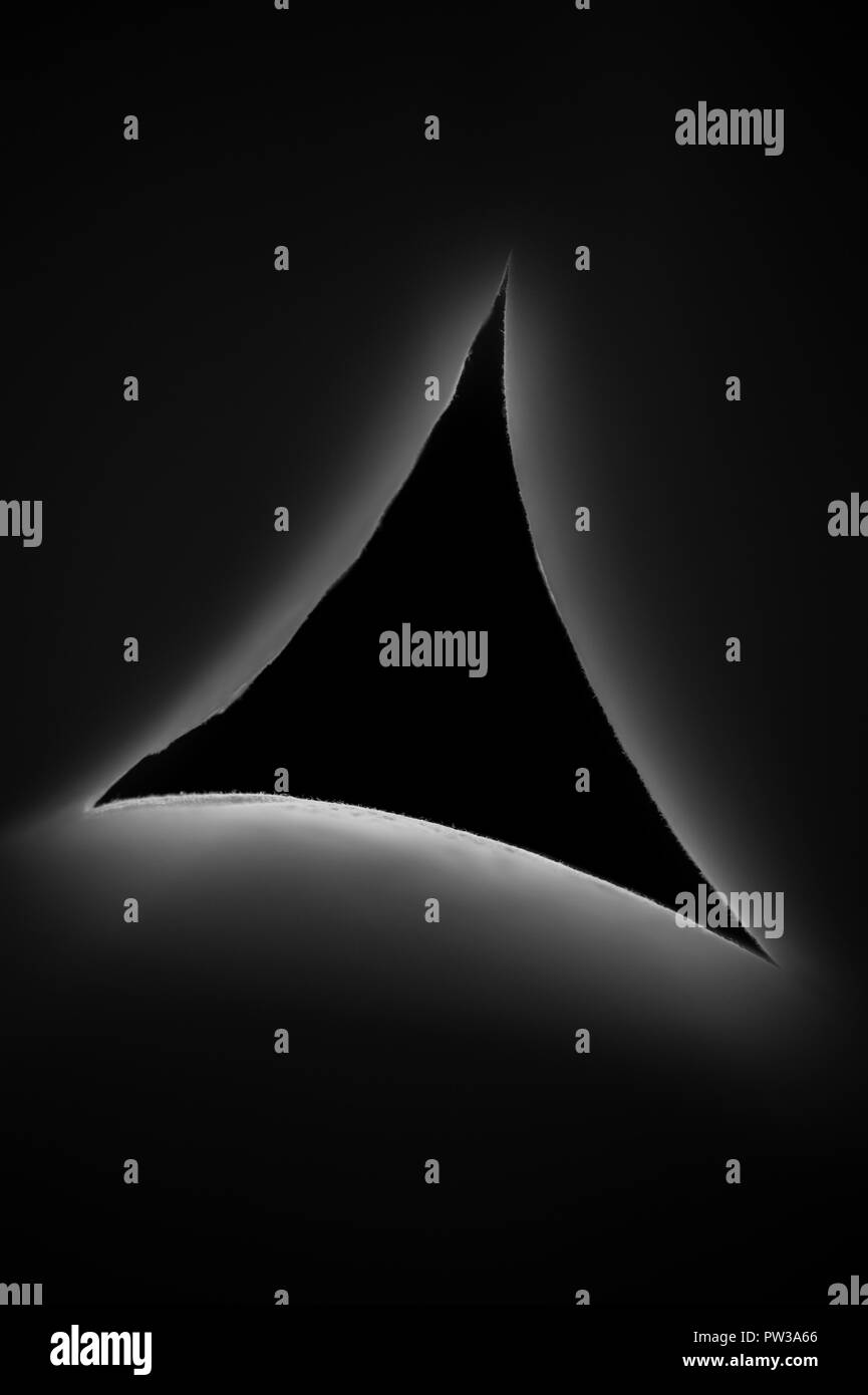 Toilet paper stacked with heavy contrast creating abstract patterns ...