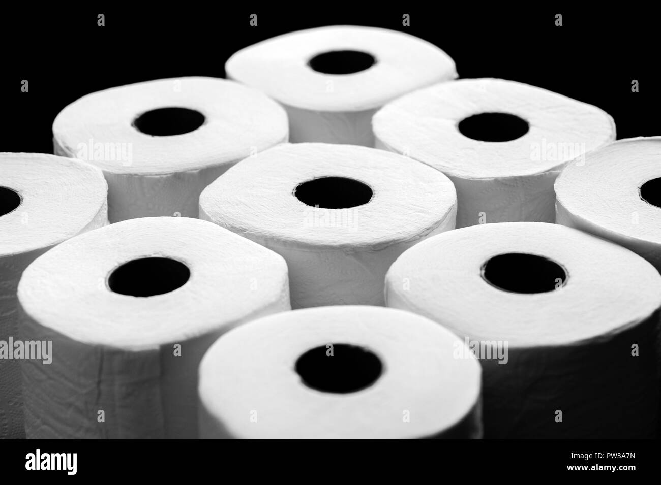Toilet paper with heavy contrast creating abstract patterns in black ...