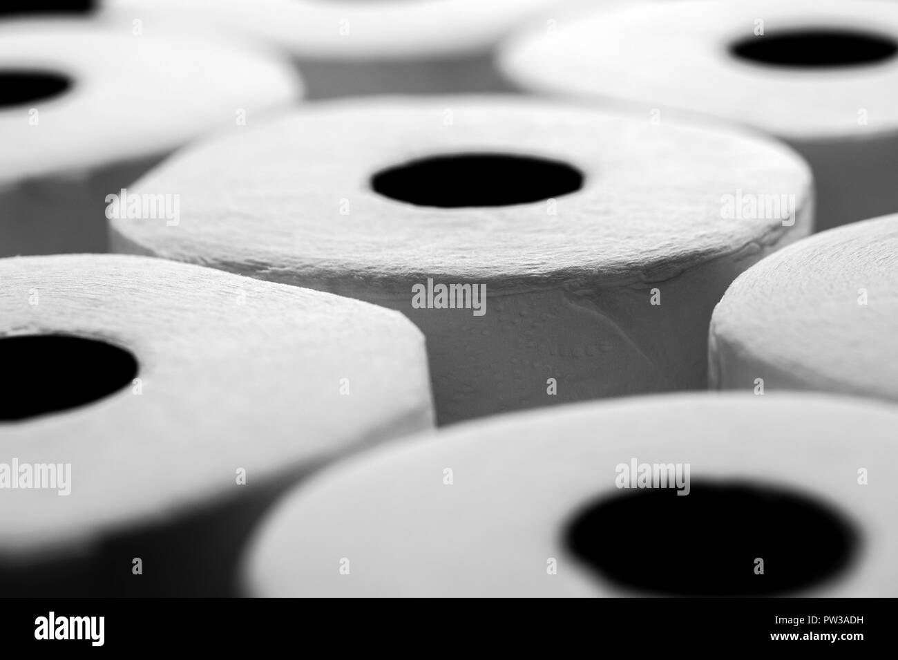 Toilet paper with heavy contrast creating abstract patterns in black ...