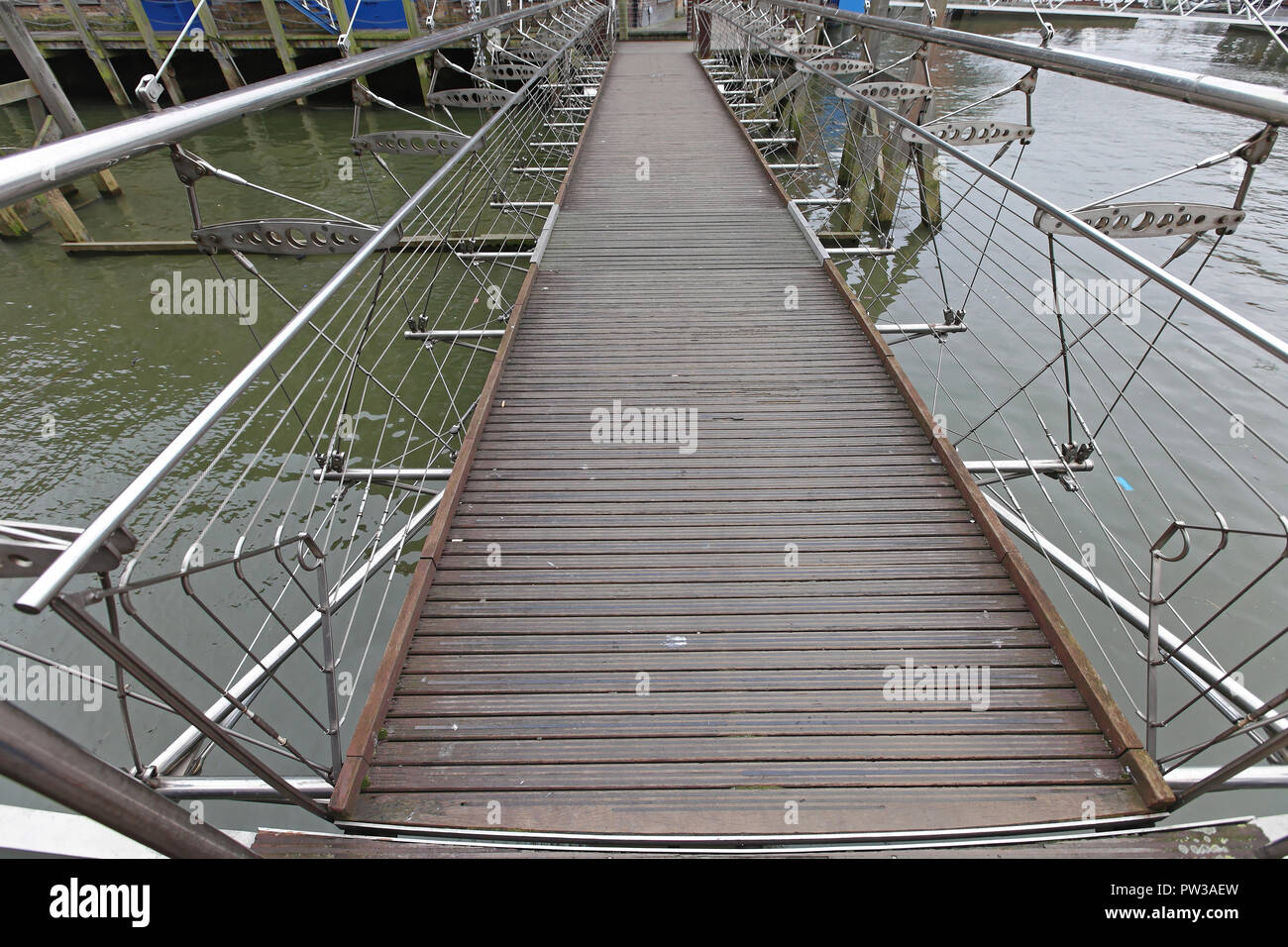 Suspension Bridge For Pedestrians Over Canal Water Stock Photo - Alamy