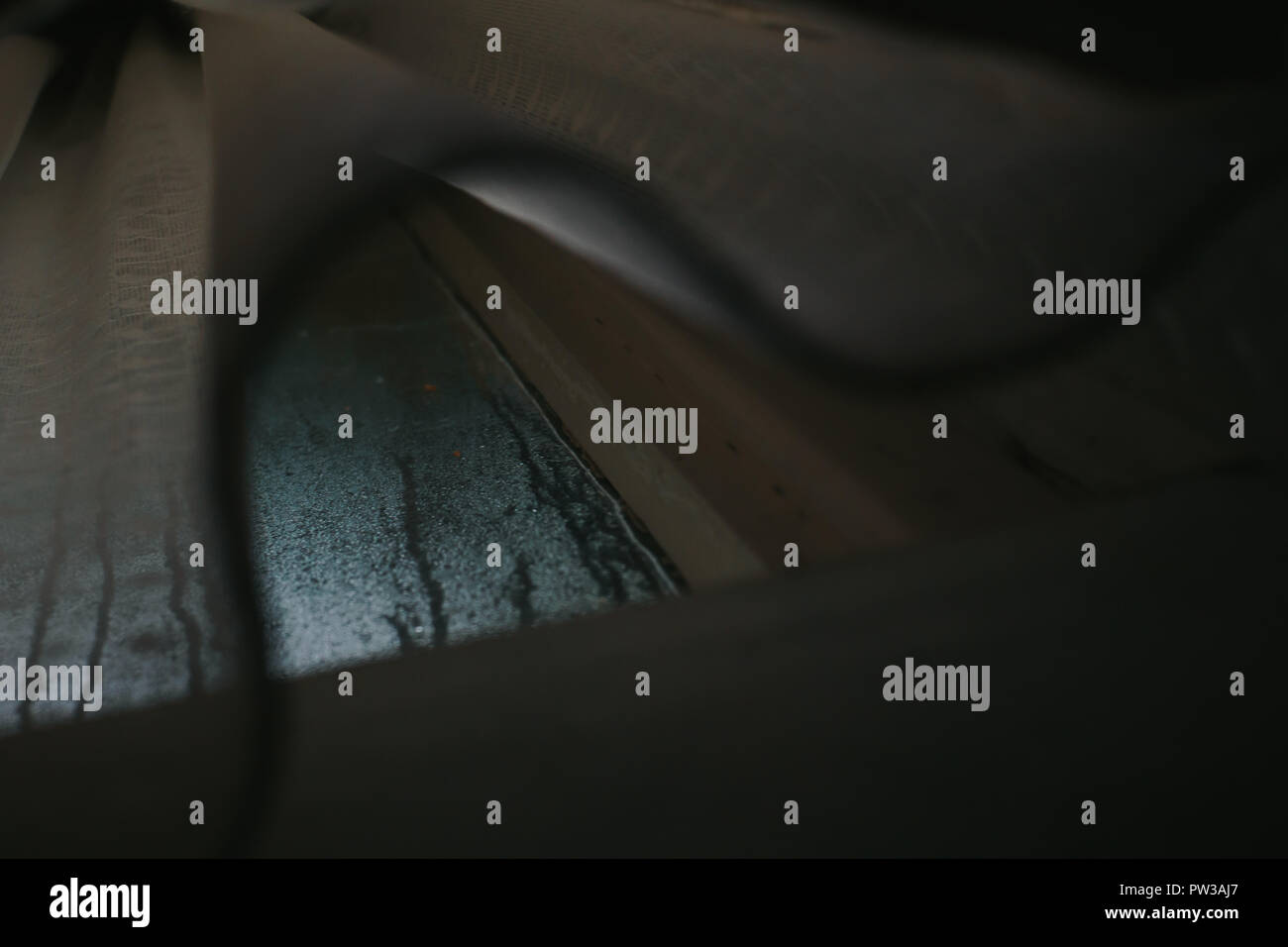 low angle picture of a window with condensation water running down ...