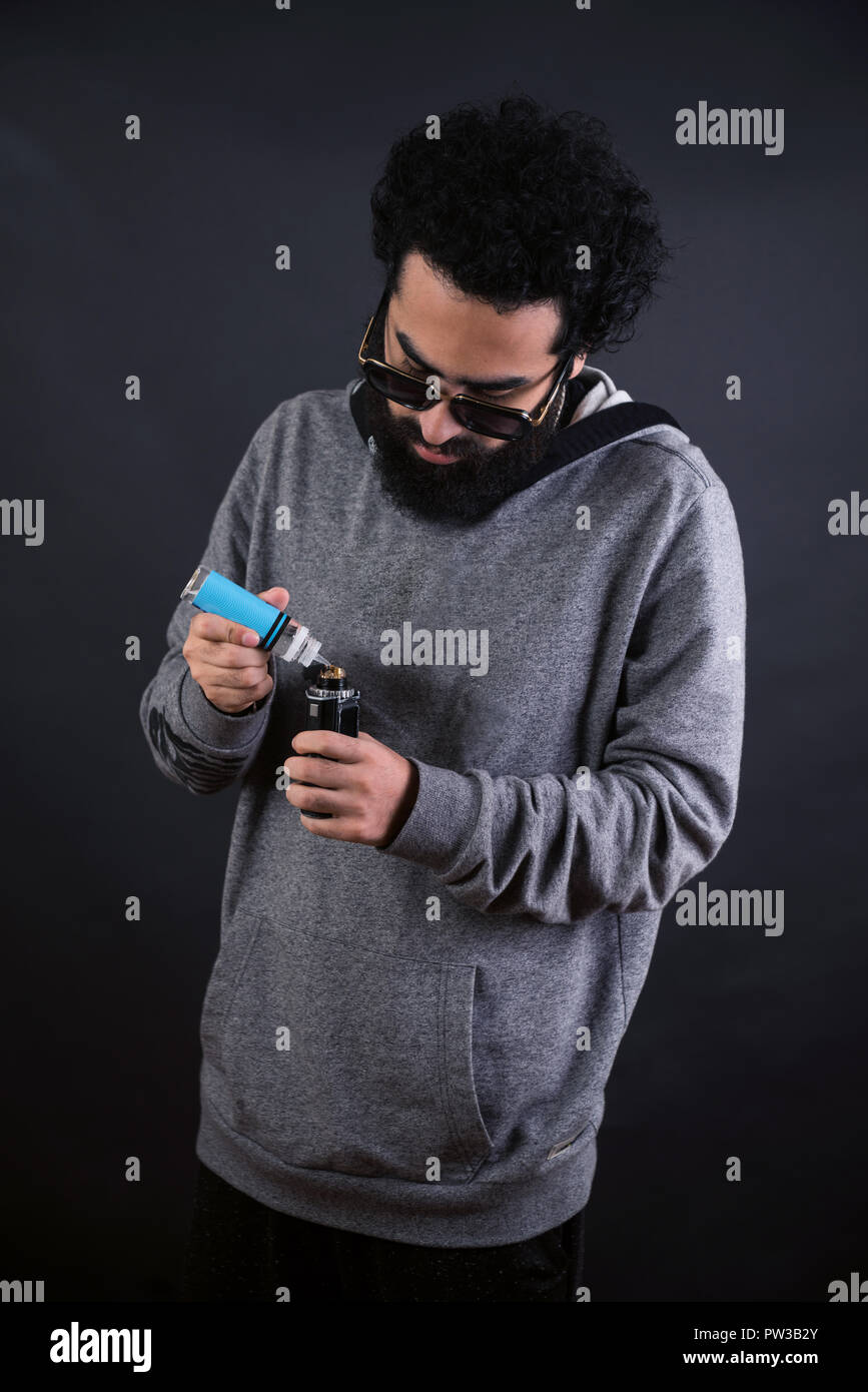 Blowing smoke from vape hi-res stock photography and images - Alamy