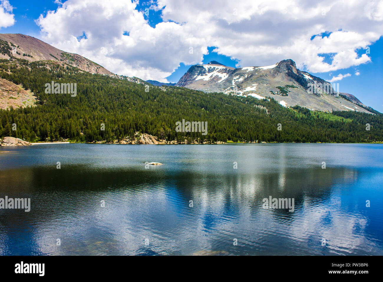 Views of Tioga Lake, an alpine lake in Yosemite National Park ...
