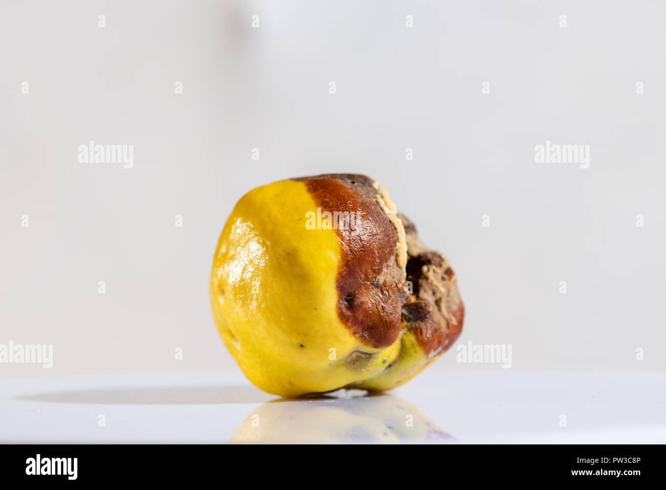 Spoiled brown fruit at isolated white background Stock Photo - Alamy