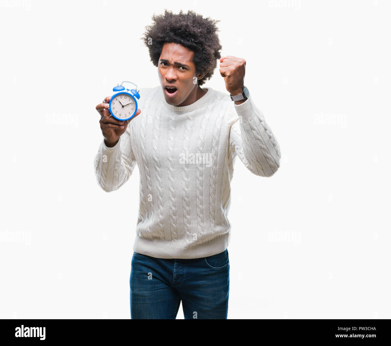Afro american man holding vintage alarm clock over isolated background ...