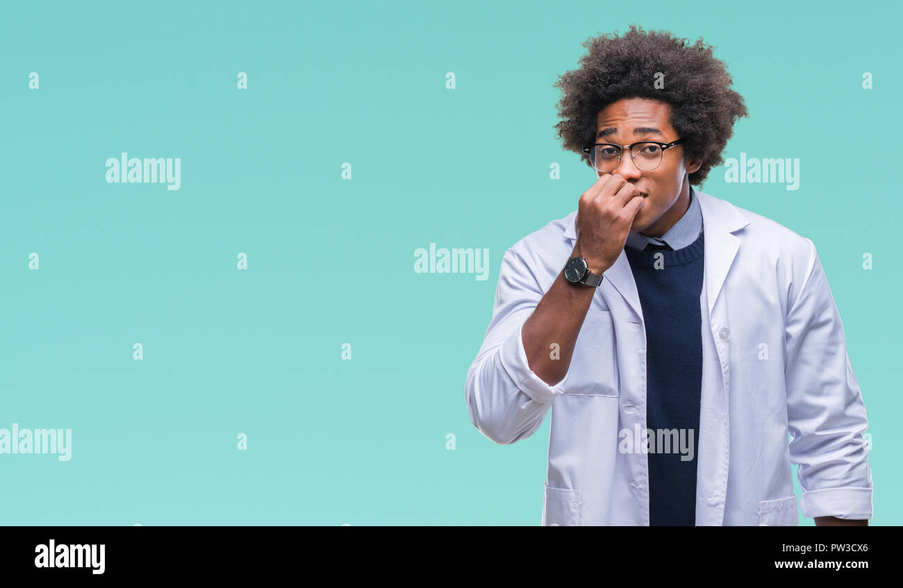 Afro american doctor scientist man over isolated background looking ...