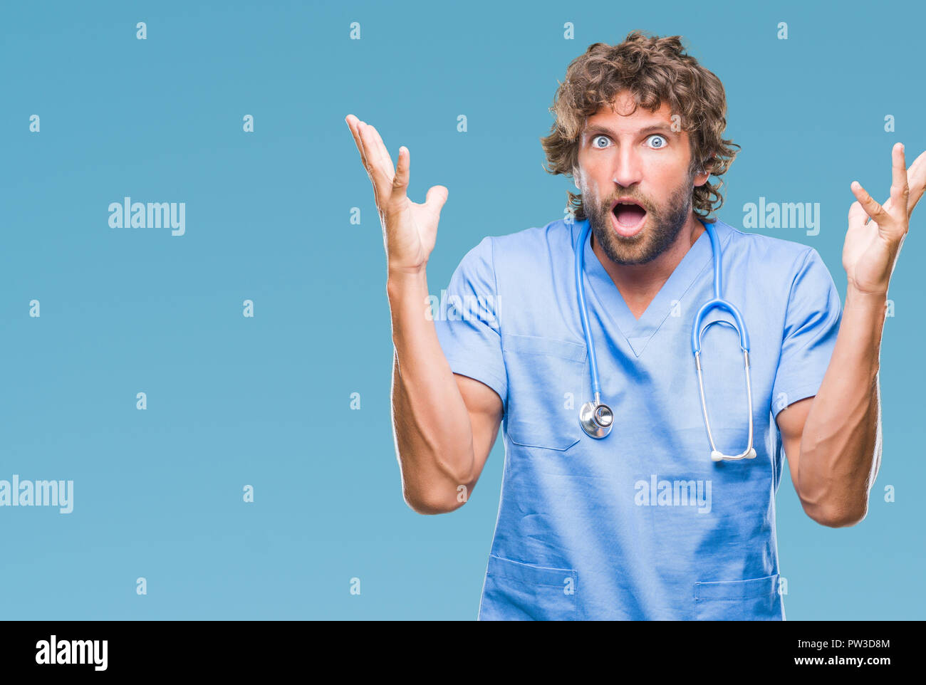 Handsome hispanic surgeon doctor man over isolated background ...