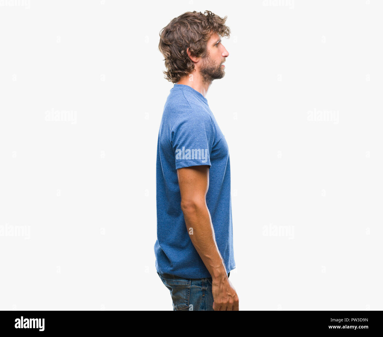 Handsome hispanic model man over isolated background looking to side ...