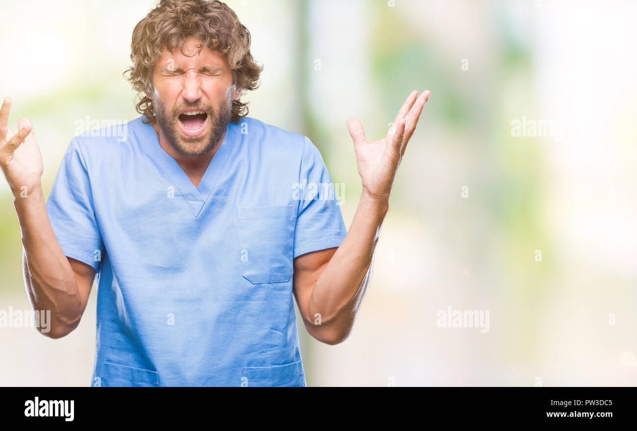Handsome hispanic surgeon doctor man over isolated background ...