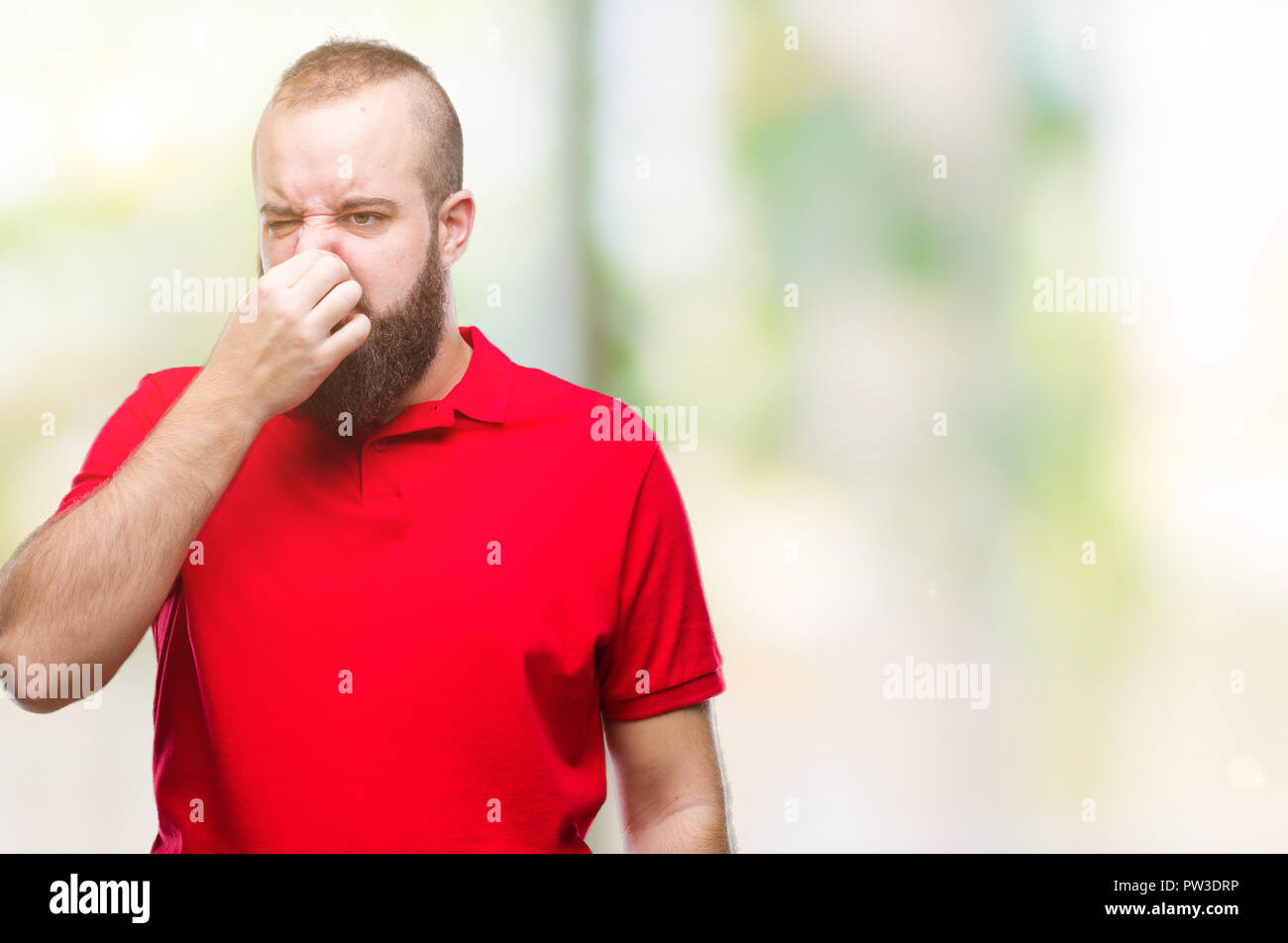 Young caucasian hipster man wearing red shirt over isolated background ...