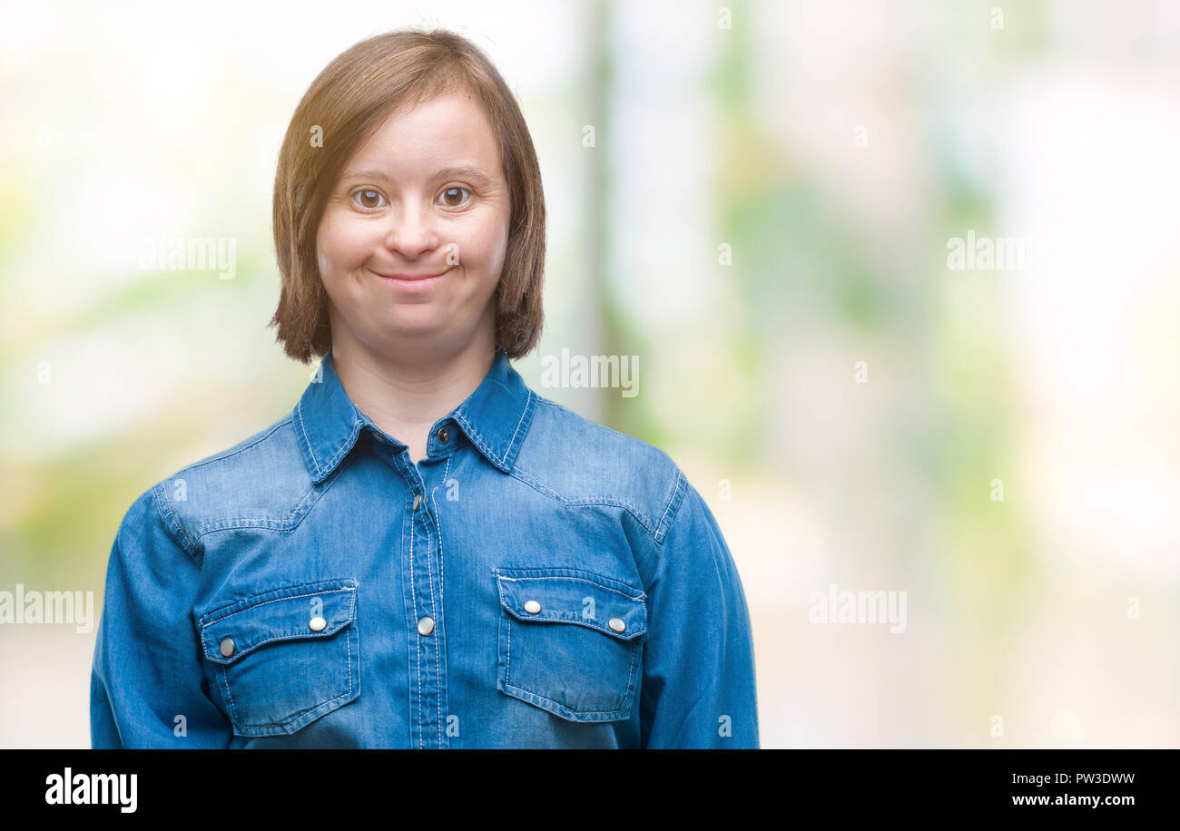 Young adult woman with down syndrome over isolated background with a ...
