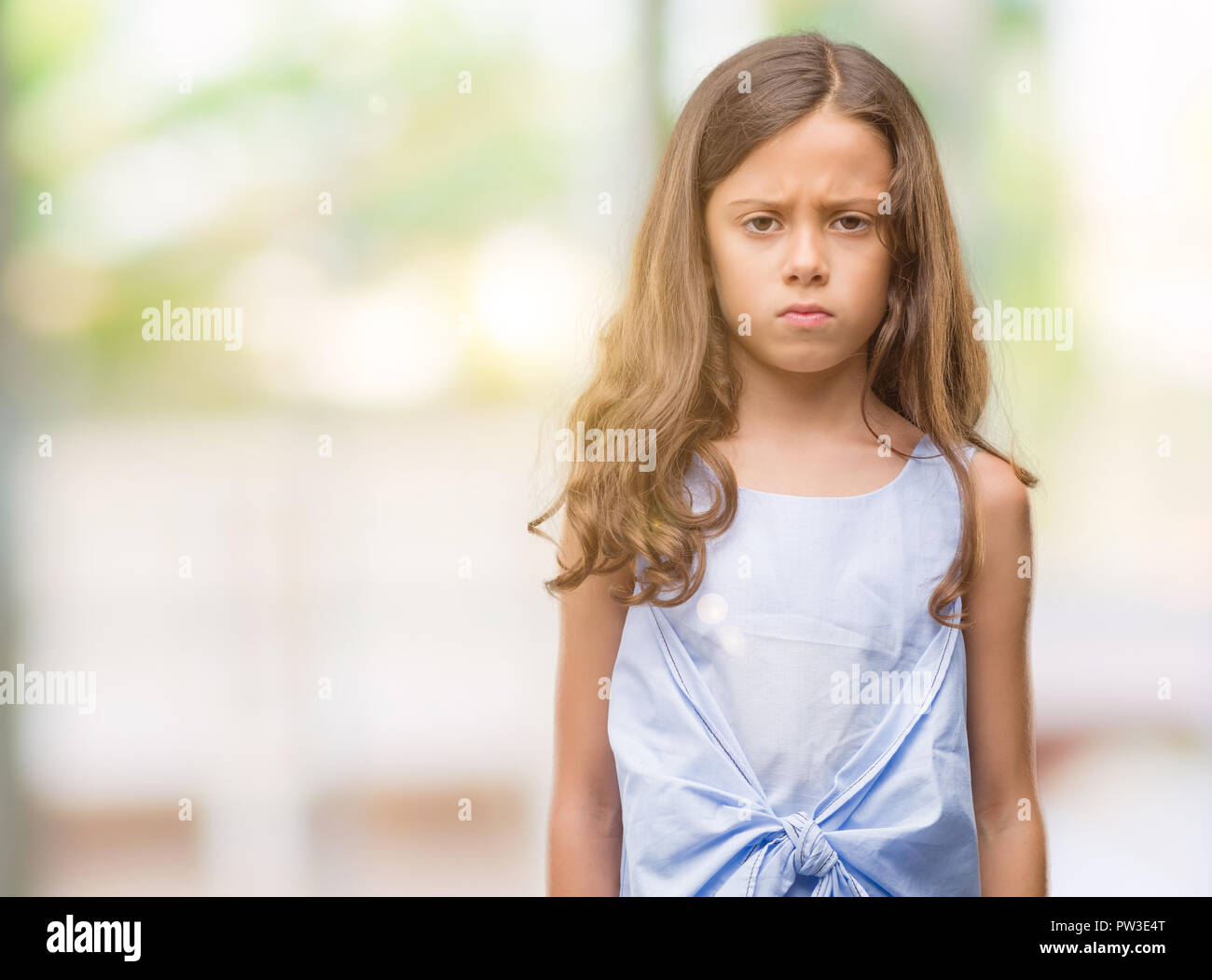 Brunette hispanic girl skeptic and nervous, frowning upset because of ...