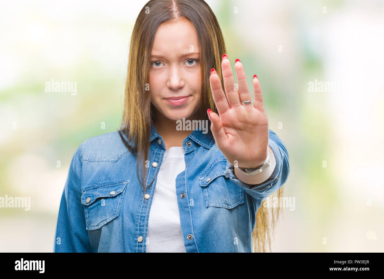 Young caucasian beautiful woman over isolated background doing stop ...