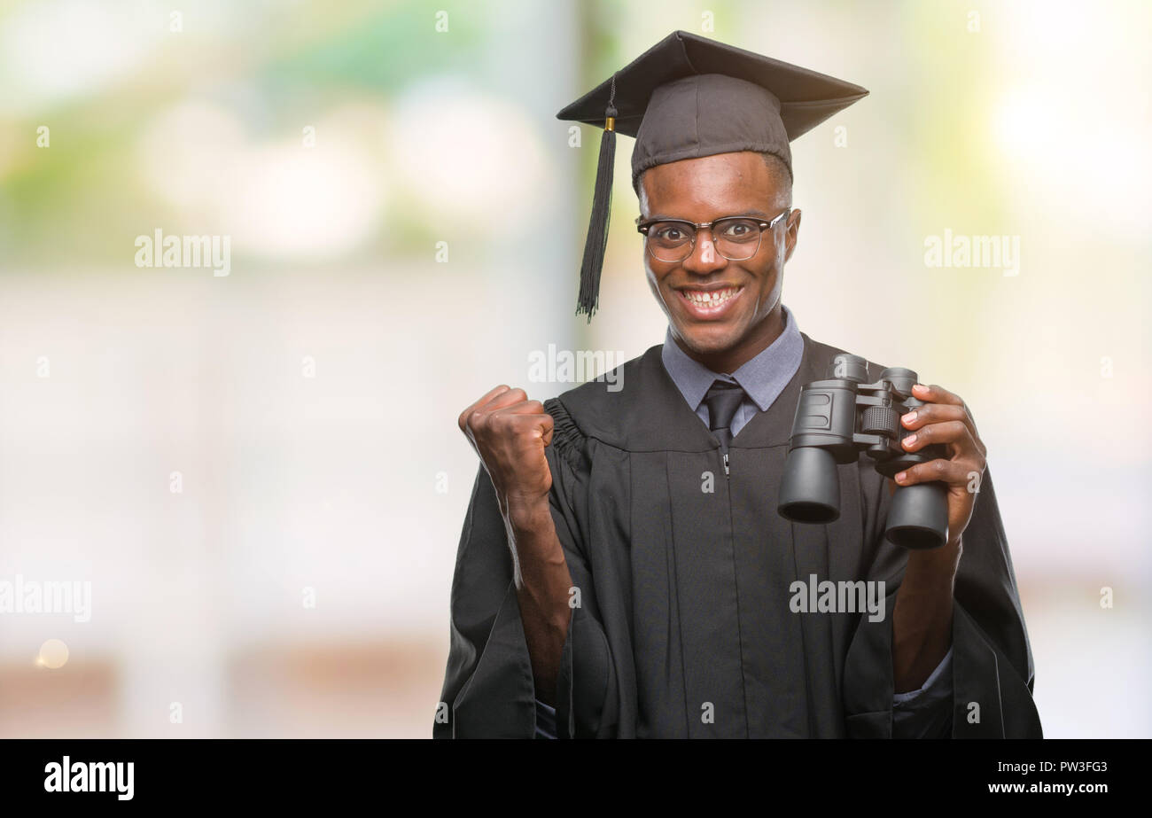 African man celebrating success using hi-res stock photography and ...