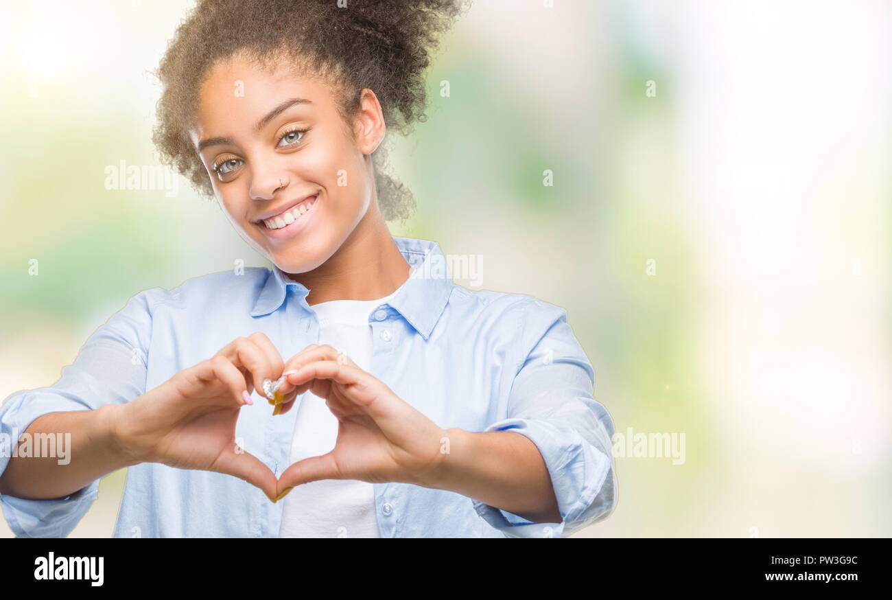 Young afro american woman over isolated background smiling in love ...