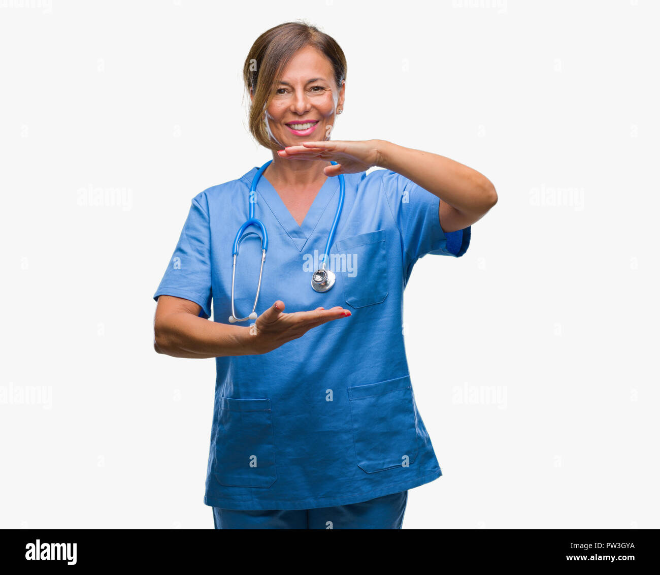 Middle age senior nurse doctor woman over isolated background gesturing ...