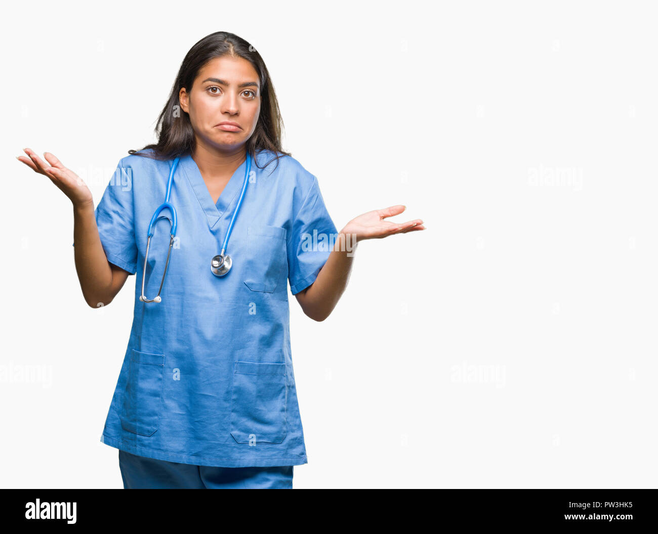 Young arab doctor surgeon woman over isolated background clueless and ...