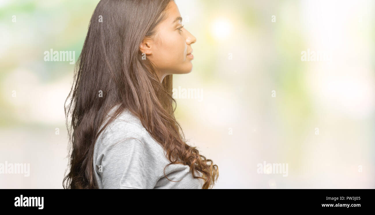 Young beautiful arab woman over isolated background looking to side ...