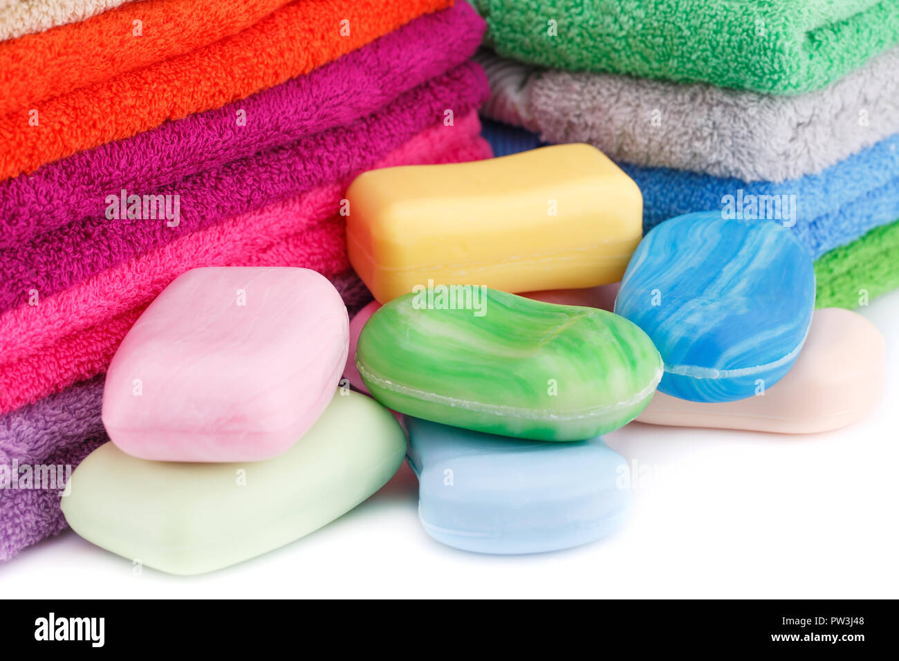 Colorful towels stacks and soaps closeup picture Stock Photo - Alamy