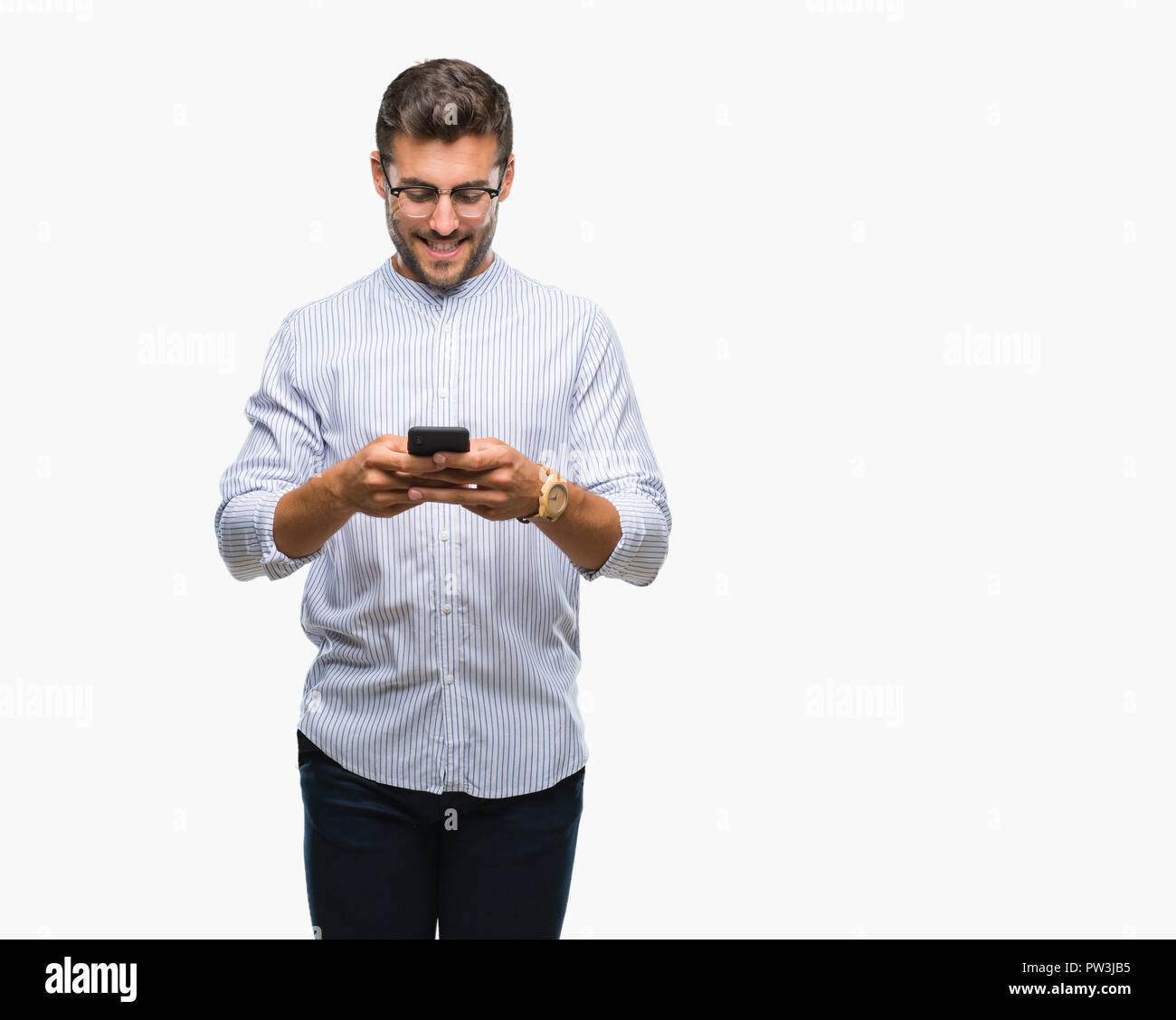 Young handsome man texting using smartphone over isolated background ...