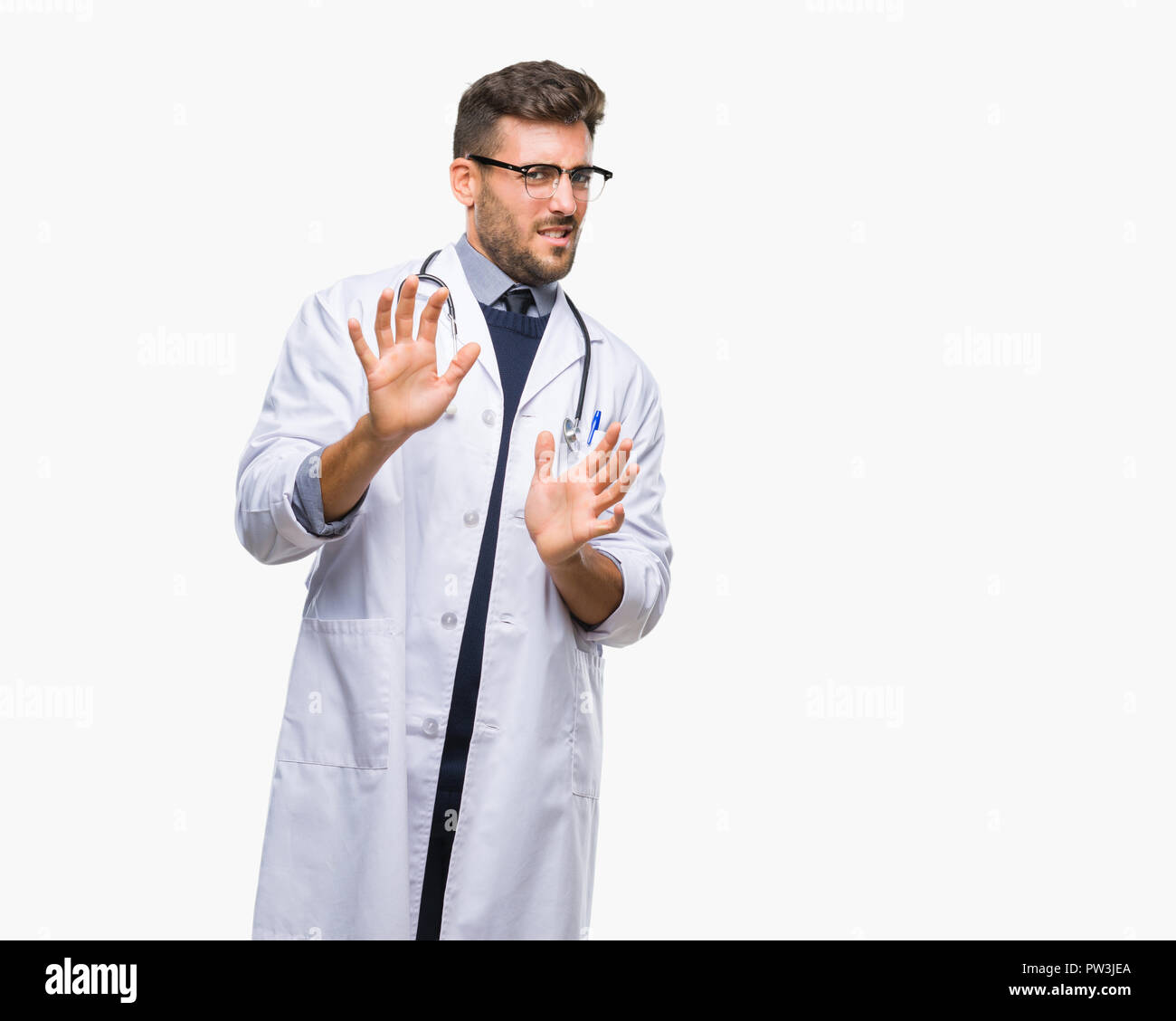 Young handsome doctor man over isolated background disgusted expression ...