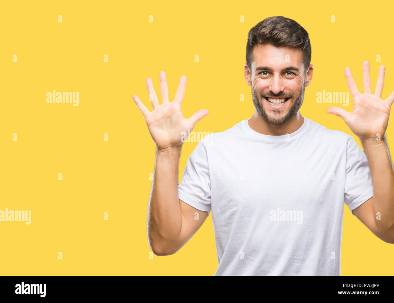Young handsome man over isolated background showing and pointing up ...