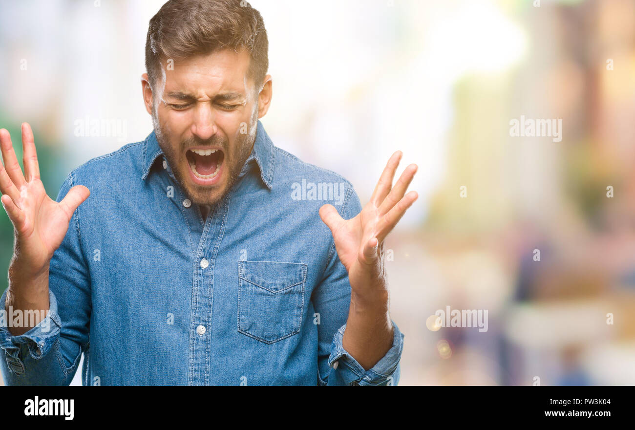 Young handsome man over isolated background celebrating mad and crazy ...