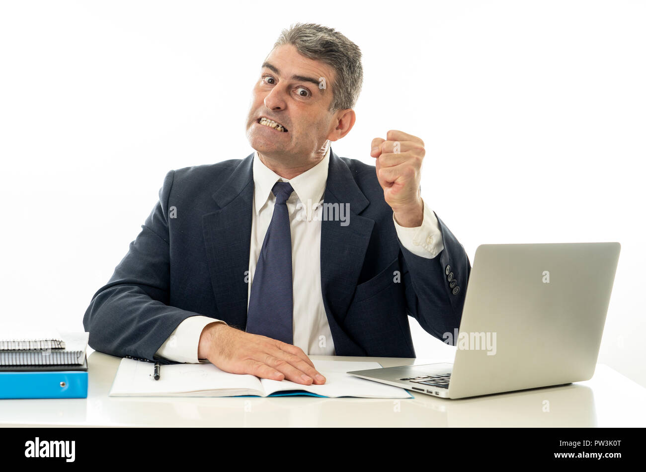 Angry and desperate businessman shouting with laptop computer and ...